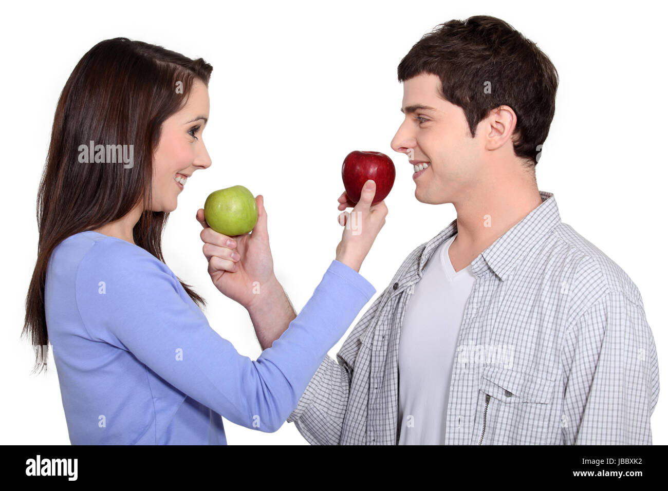 Couple exchanging apples Stock Photo - Alamy