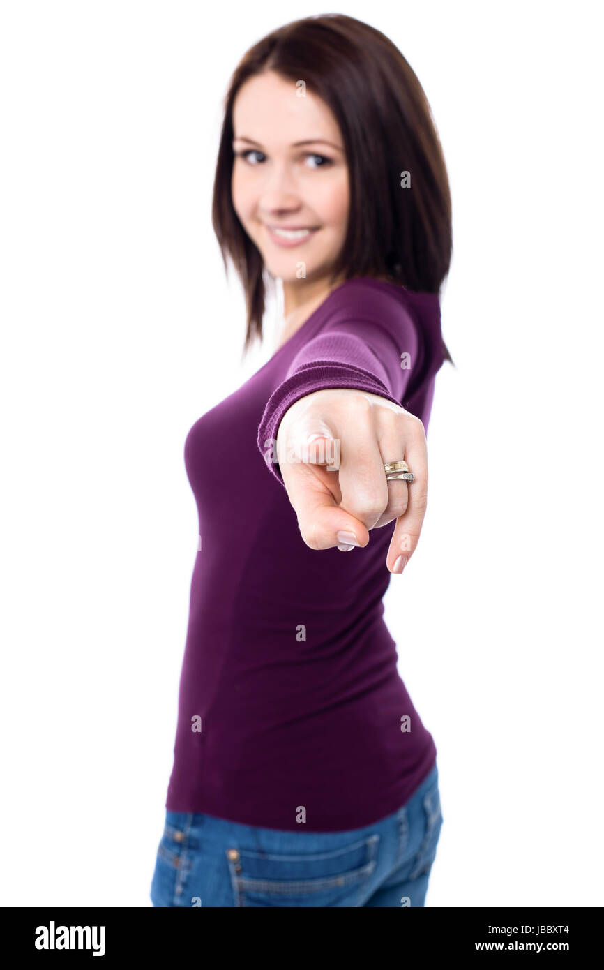 Beautiful young girl pointing you out over white Stock Photo - Alamy