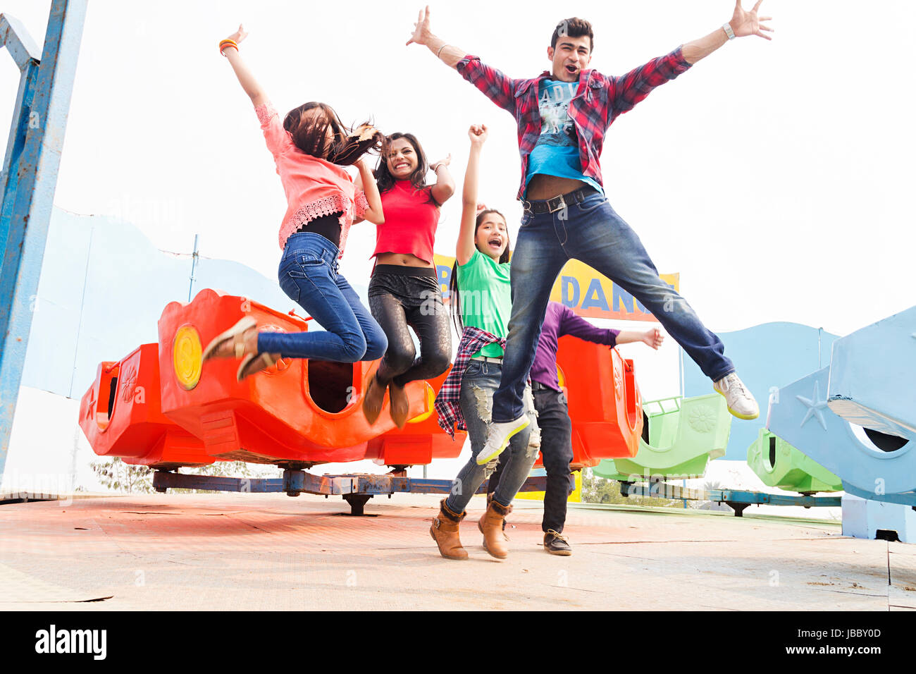 Happy Group Young Friends Jumping Together Fun Cheerful Amusement Park ...