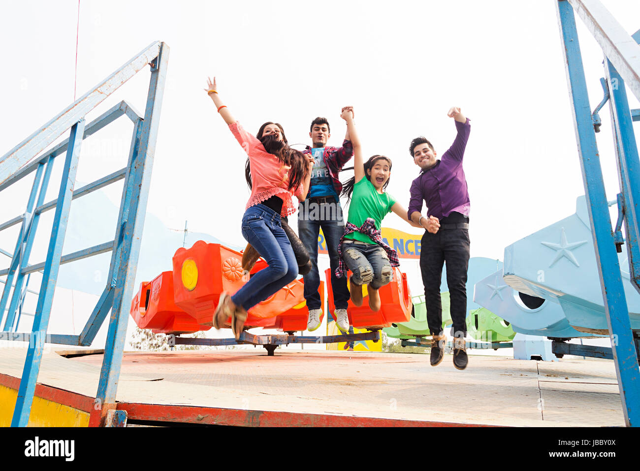 Happy Group Teenager Friends Jumping Together Fun Cheerful Fair ...