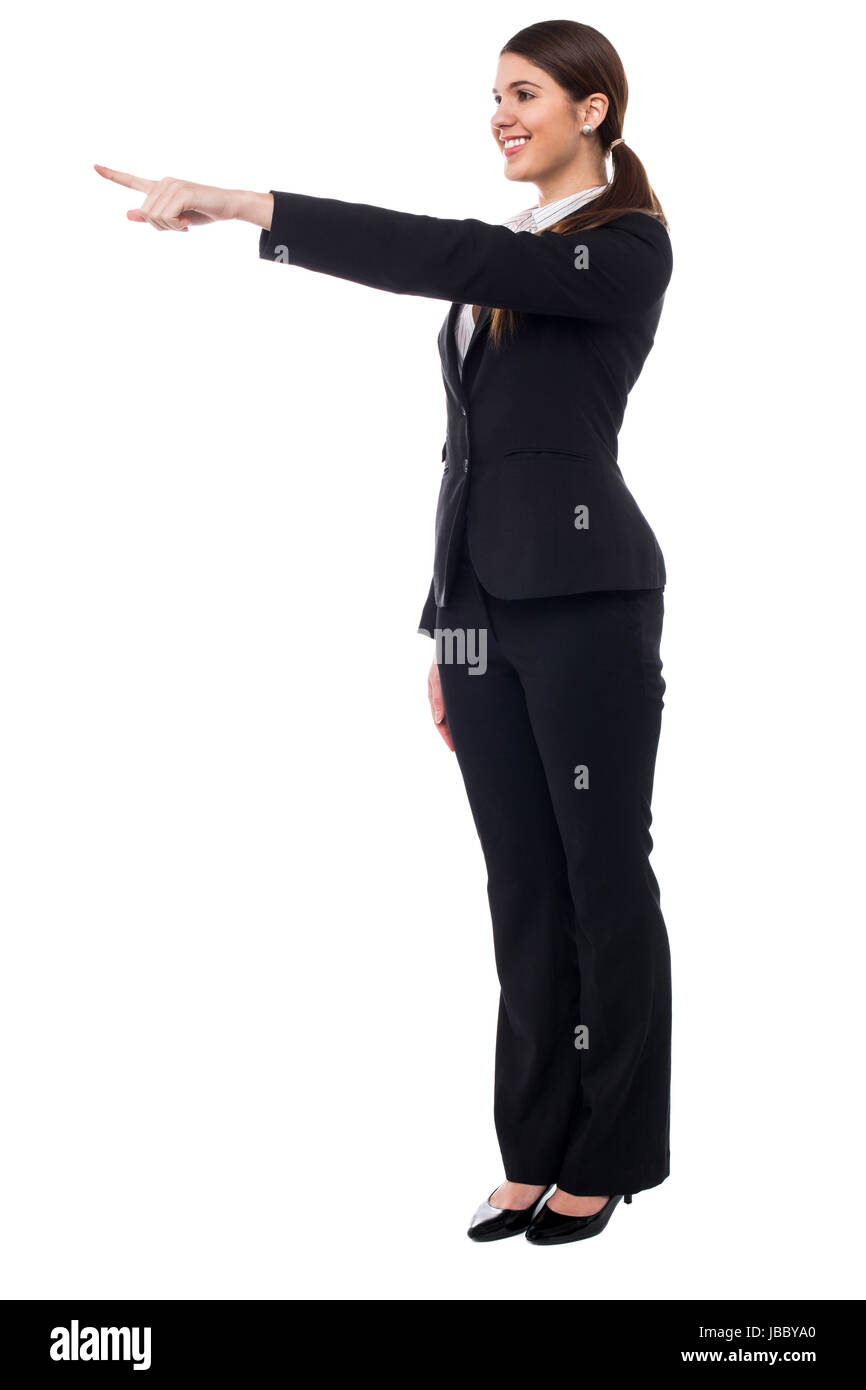 Full length studio shot of business lady pointing at something Stock ...