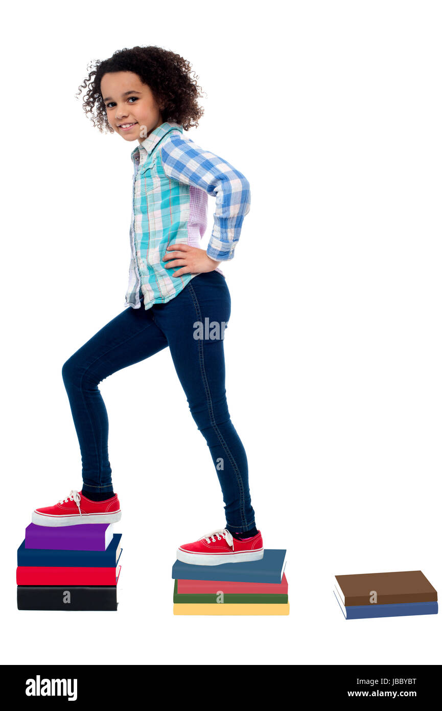 Smart active girl kid climbing notebooks ladder Stock Photo - Alamy