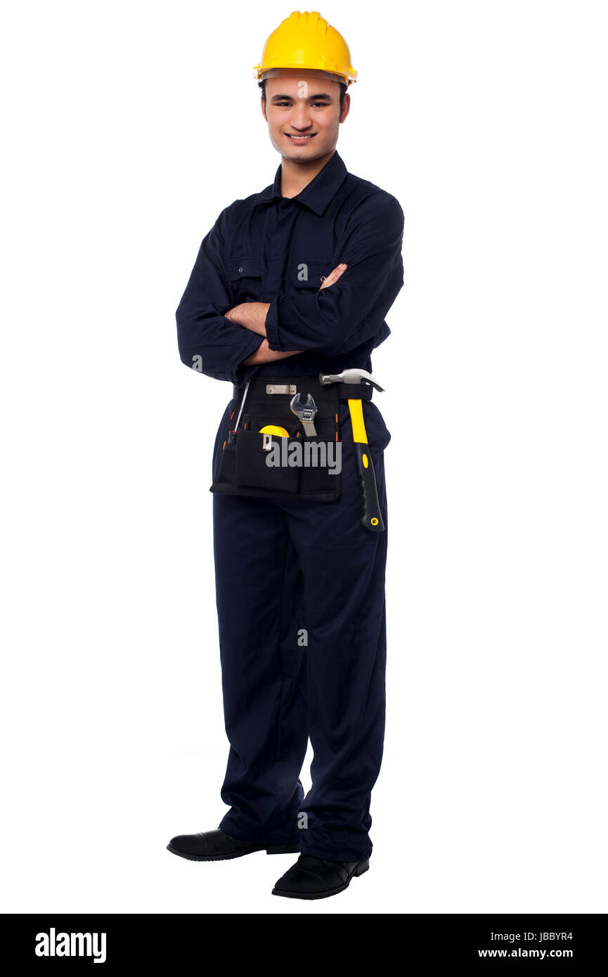 Confident young male worker posing with arms crossed Stock Photo - Alamy
