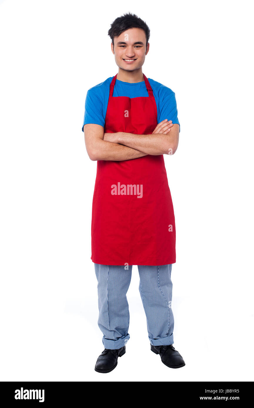 Full length studio shot of male chef posing with arms crossed Stock ...