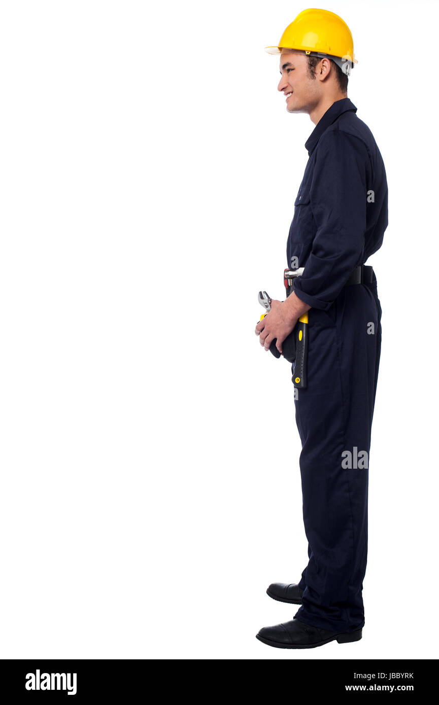 Side pose architect holding hammer Cut Out Stock Images & Pictures - Alamy