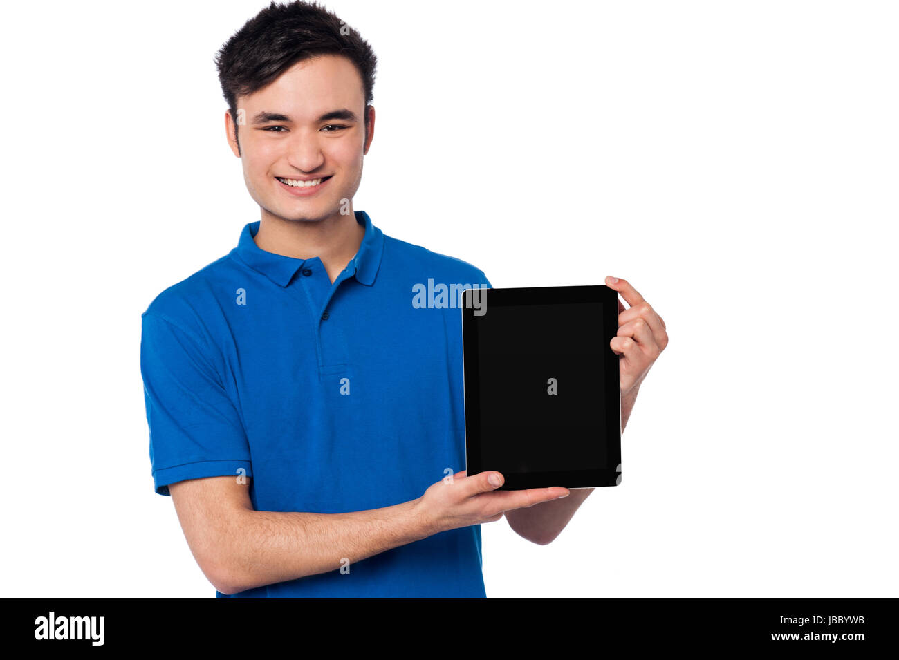 Young handsome guy presenting brand new tablet device Stock Photo - Alamy