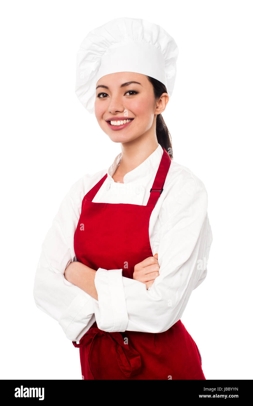 Pretty baker woman posing with confidence, arms folded Stock Photo - Alamy