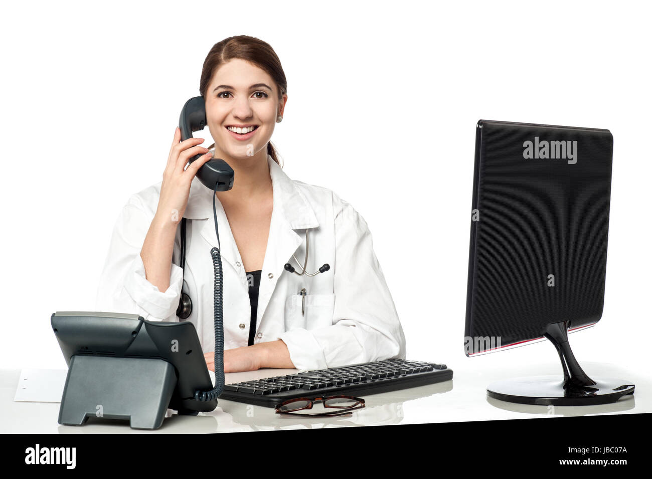 Pretty young woman answering call hi-res stock photography and images ...