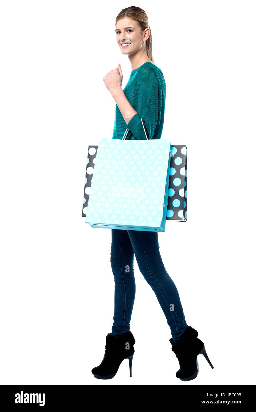 Full length image of a shopaholic girl Stock Photo - Alamy