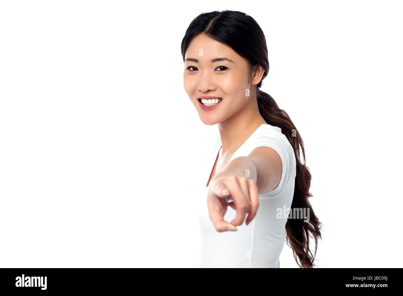 Charming young girl pointing towards the camera Stock Photo - Alamy