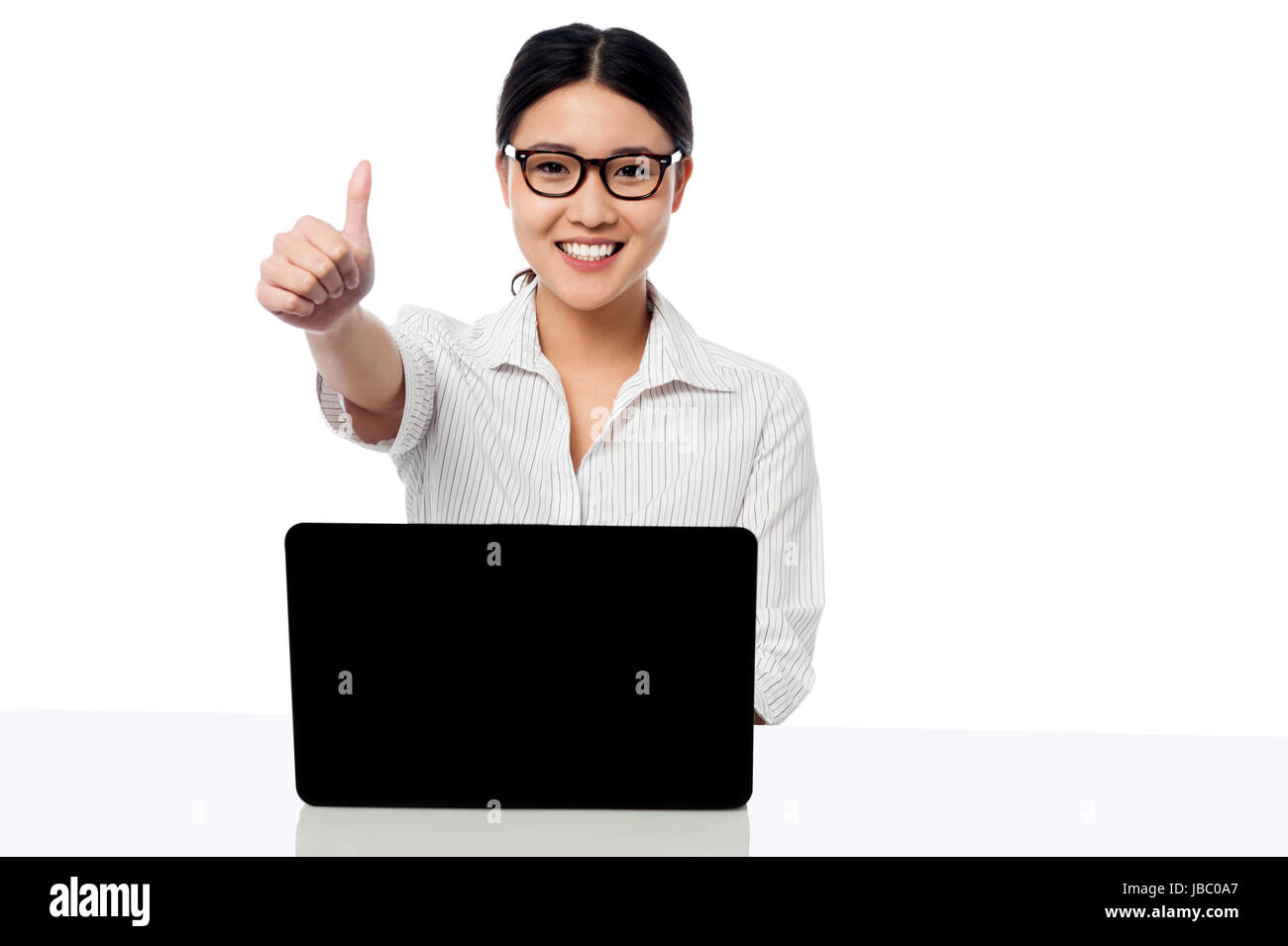 Charming corporate woman gesturing thumbs up. Keep up the great work ...