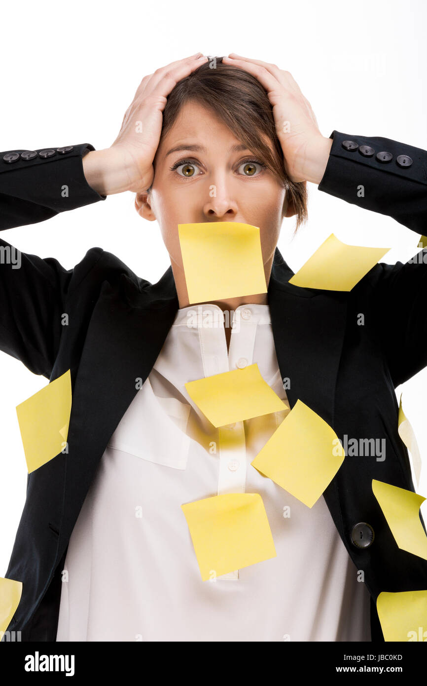 Business woman with yellow paper notes all over the body, isolated over ...