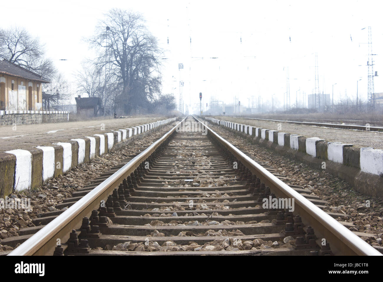 Railroad metal train tracks shot at perspective view Stock Photo - Alamy