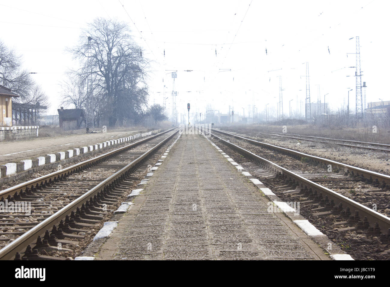 Railroad metal train tracks shot at perspective view Stock Photo - Alamy