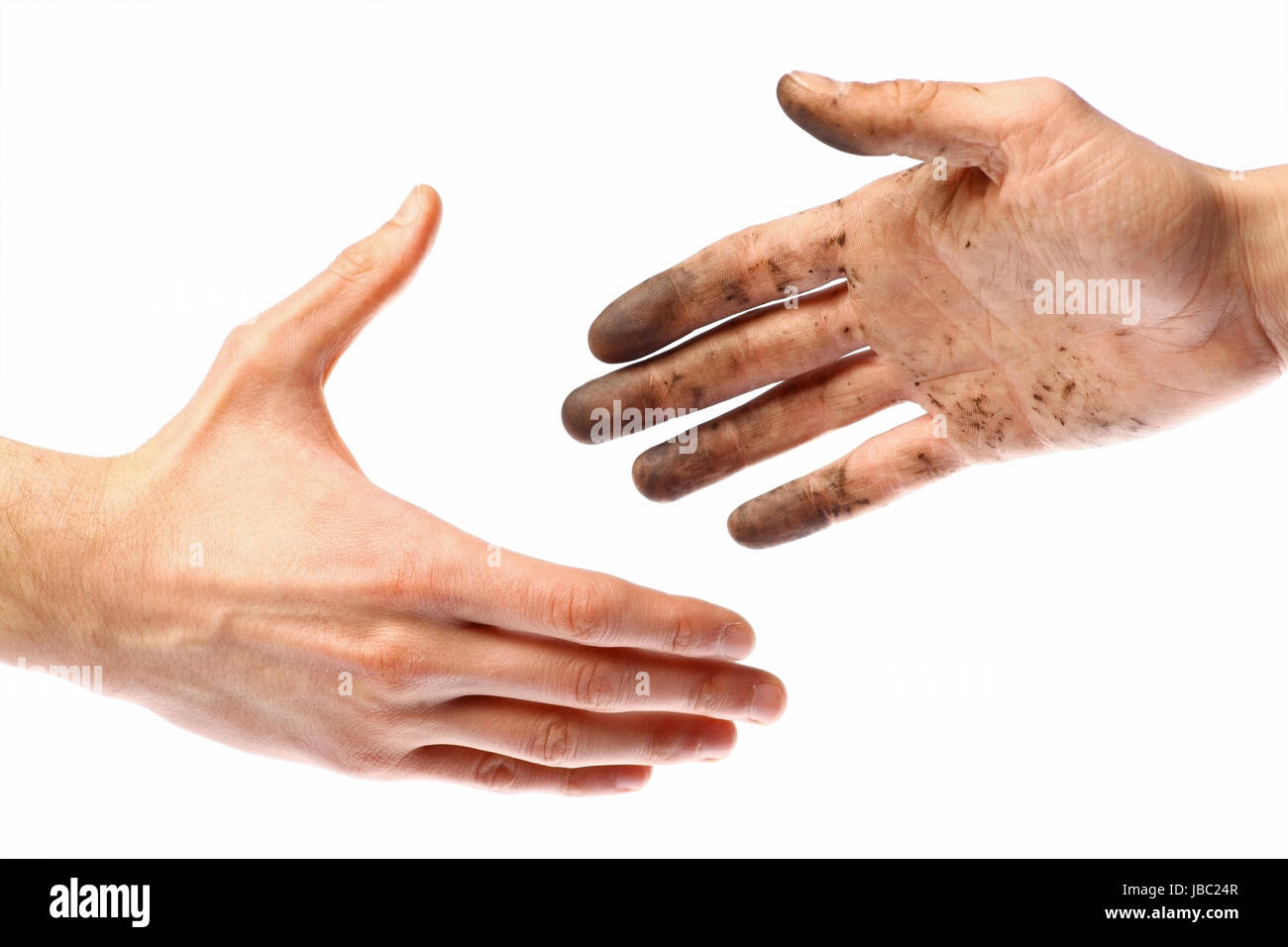 Handshake with a dirty hand and a clean one Stock Photo - Alamy