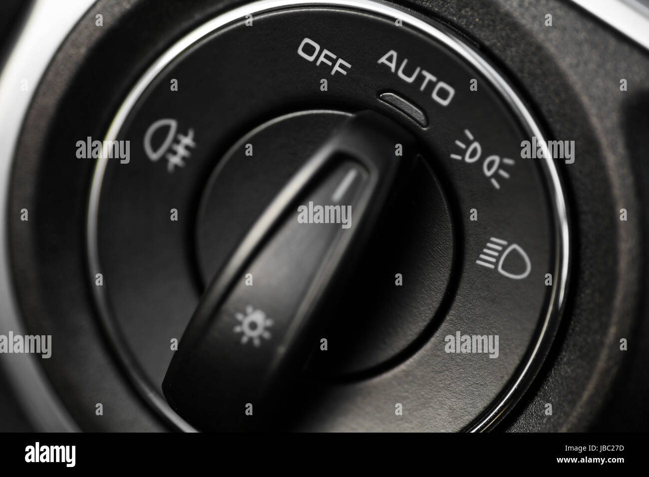 Detail of the headlight button in a car Stock Photo - Alamy