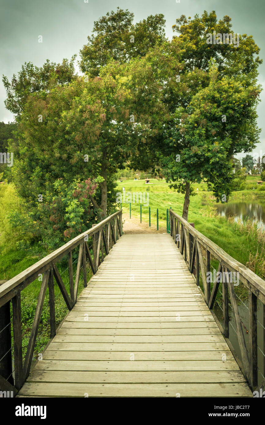 Small wooden bridge on a park Stock Photo - Alamy
