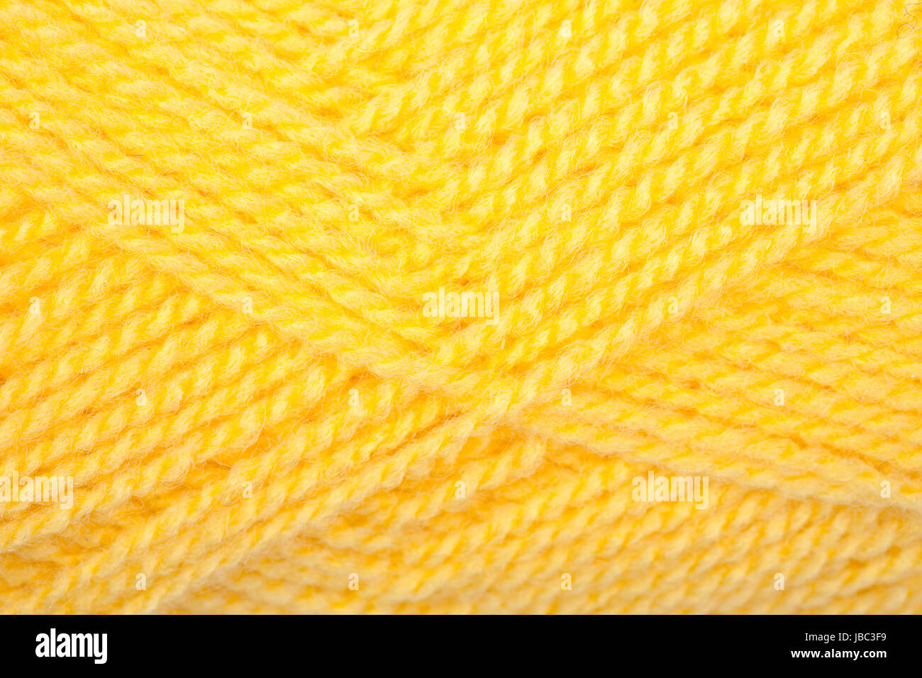 Yellow clew wool as texture for backgrounds Stock Photo - Alamy