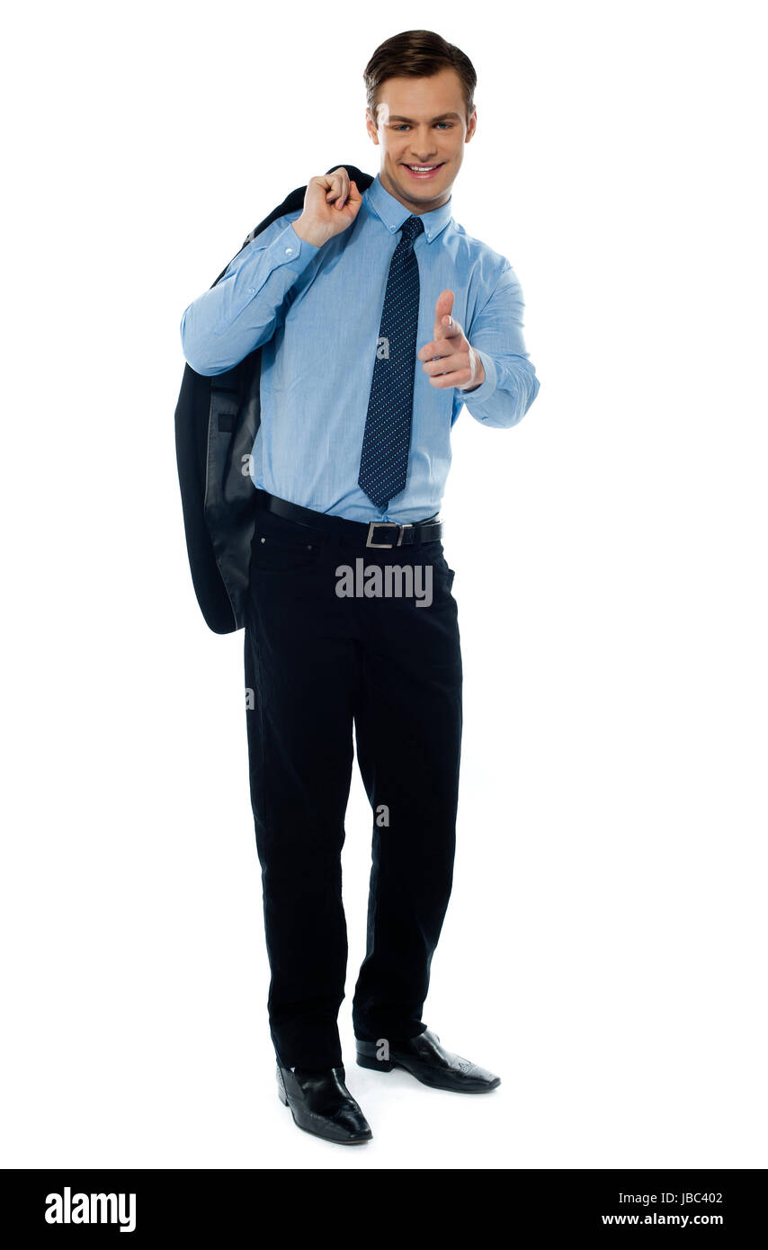 Young manager pointing towards camera on white background Stock Photo ...