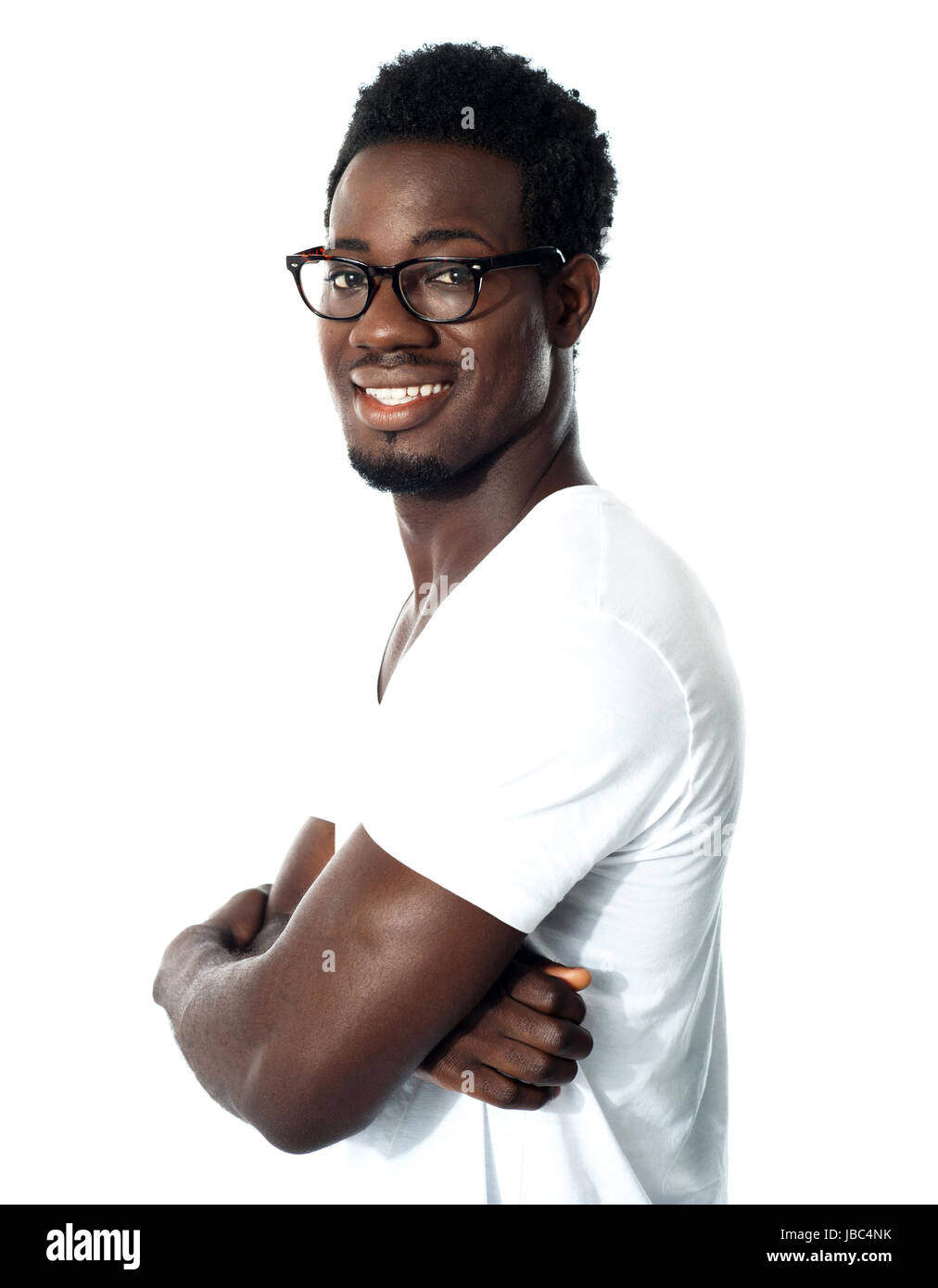 Black man posing with crossed arms and wearing glasses Stock Photo - Alamy