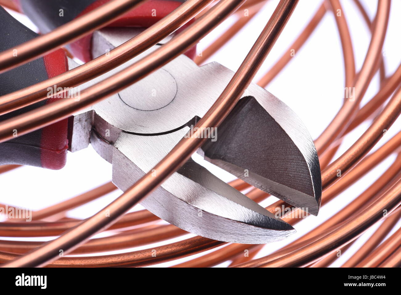 Copper wire and cutting tool close up Stock Photo - Alamy