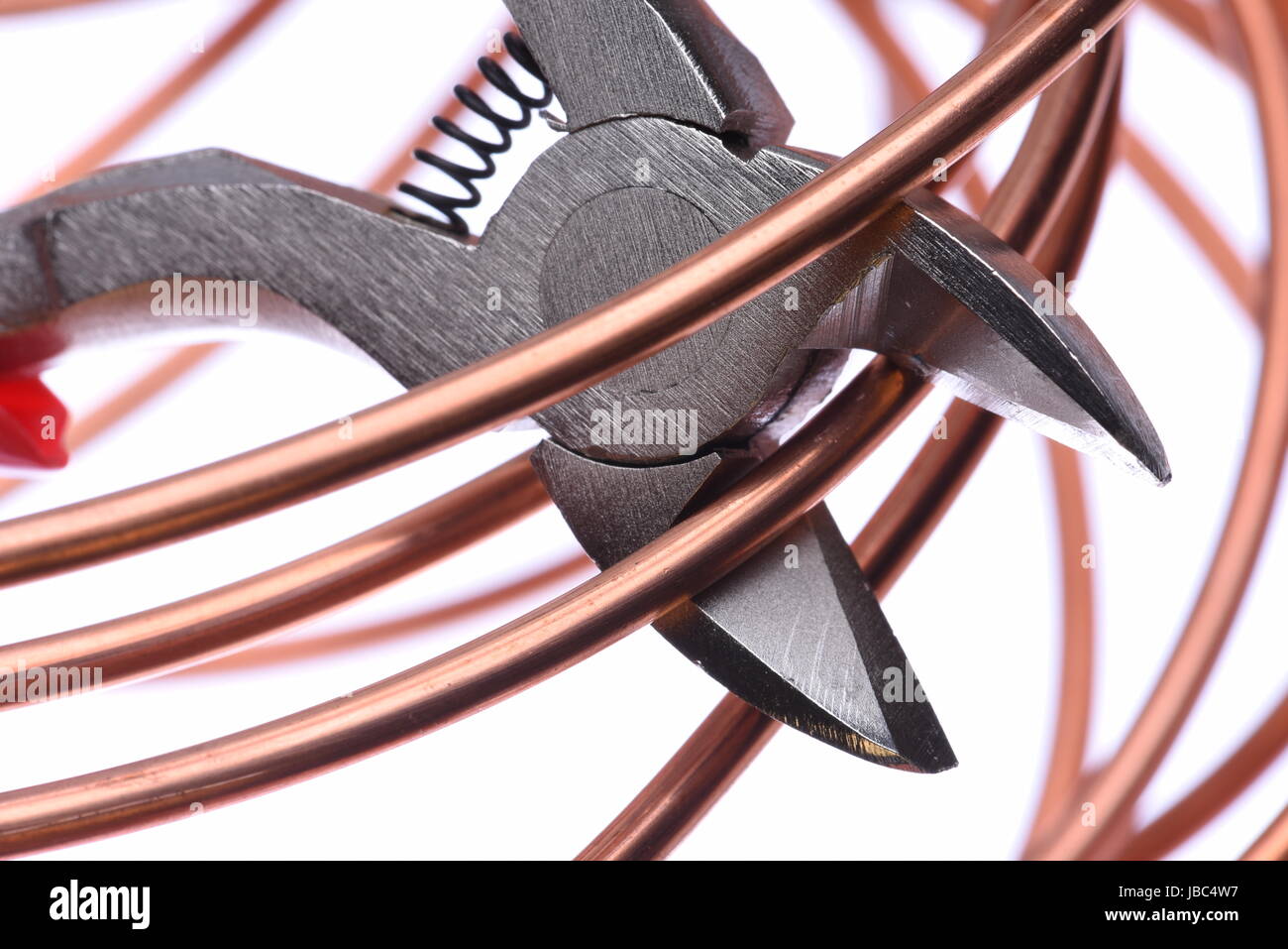 Copper wire and cutting tool close up Stock Photo - Alamy