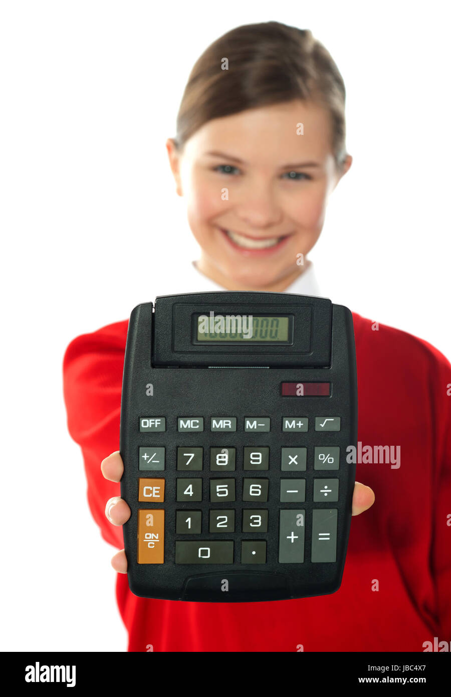 Smiling girl showing digital calculator to camera Stock Photo - Alamy