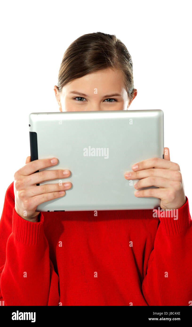 Beautiful girl hiding her face with touch pad and smiling at camera ...