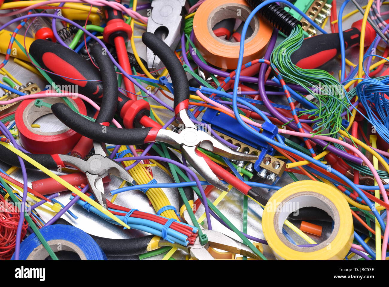 Set of electrical tools and components on metal background Stock Photo ...