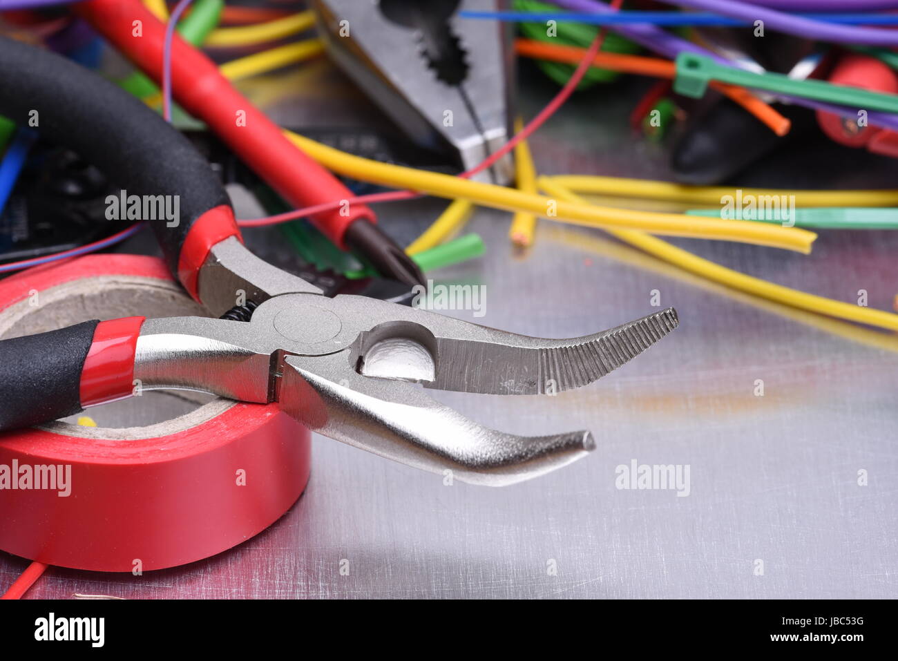 Set of electrical tools and components on metal background Stock Photo ...