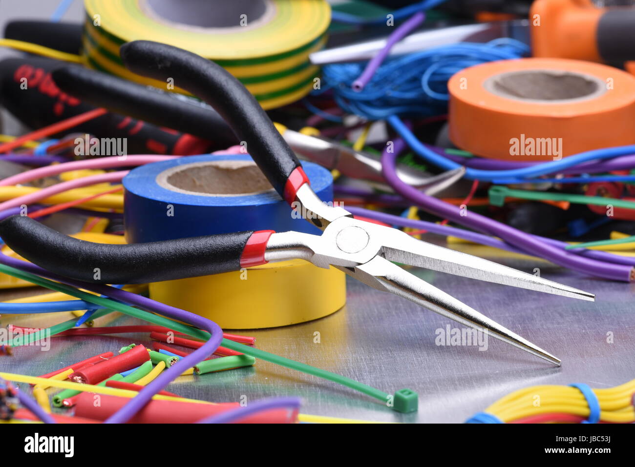 Set of electrical tools and components on metal background Stock Photo ...