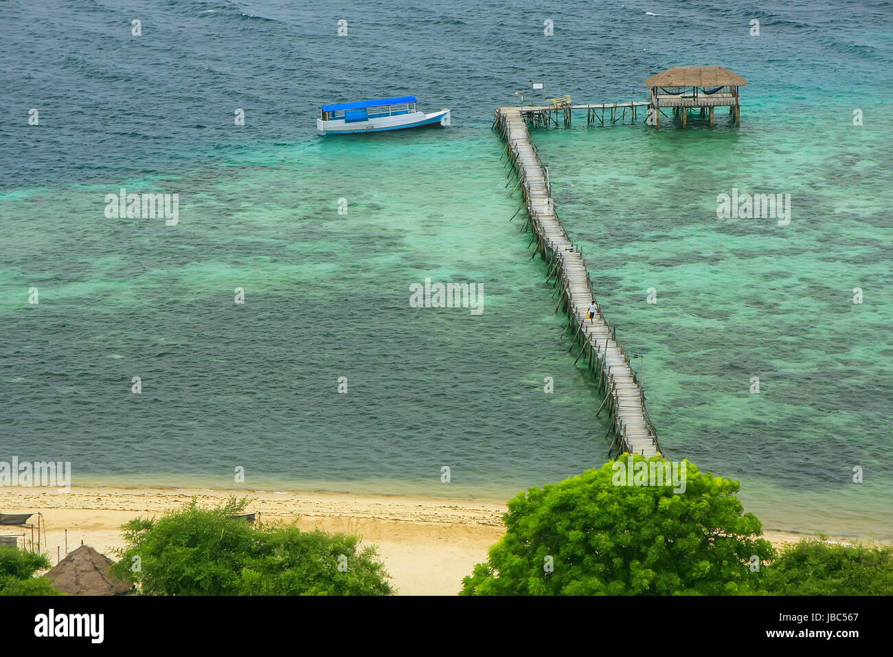 Long wooden jetty at Kanawa Island in Flores Sea, Nusa Tenggara ...