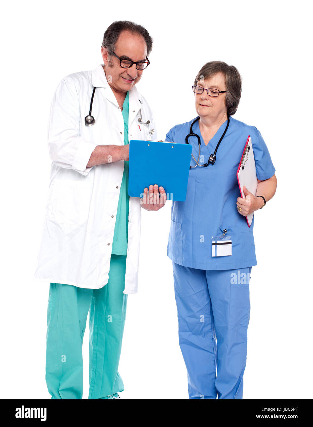 Doctors discussing a medical report isolated over white Stock Photo - Alamy