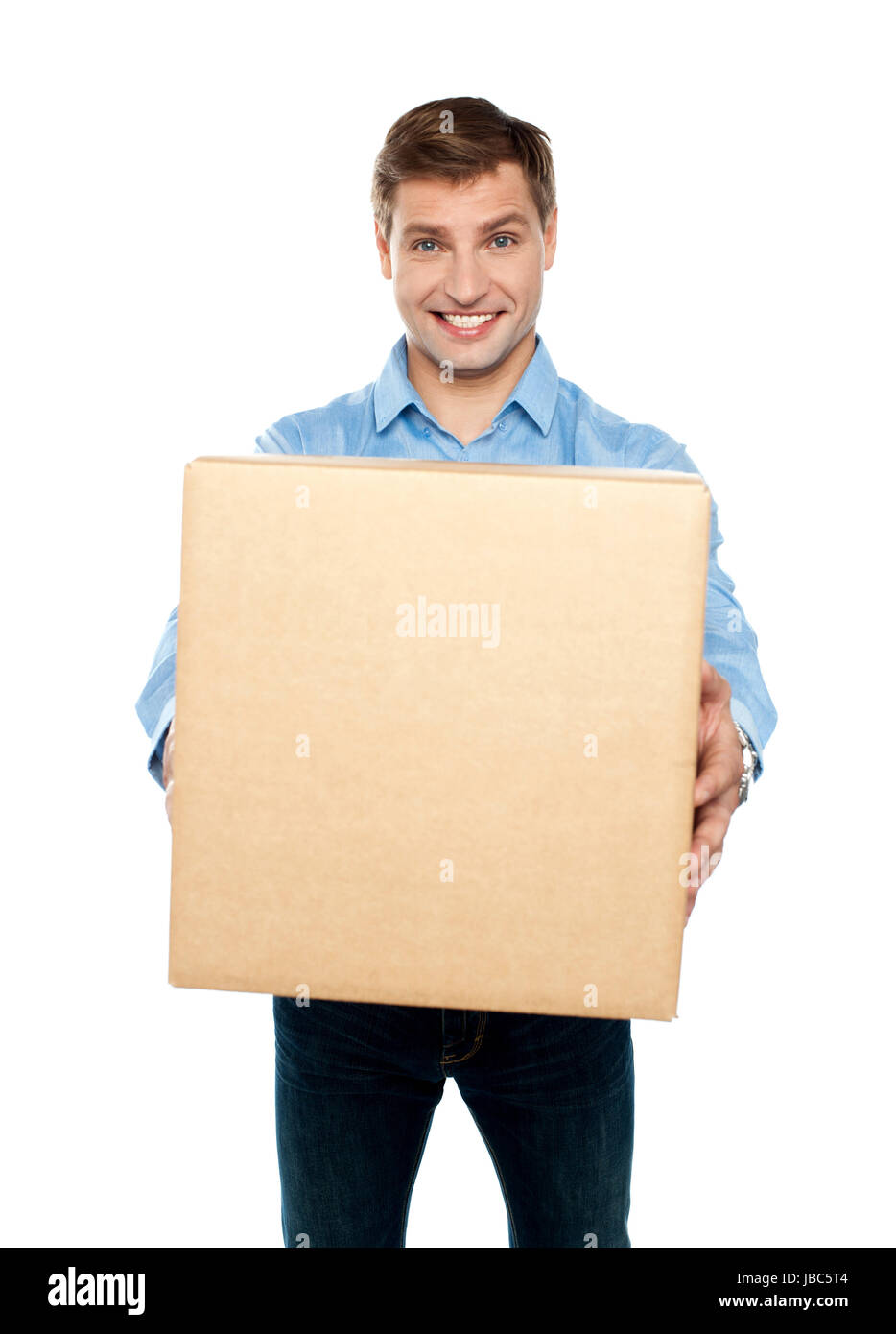 Charming handsome male holding carton isolated on white background ...