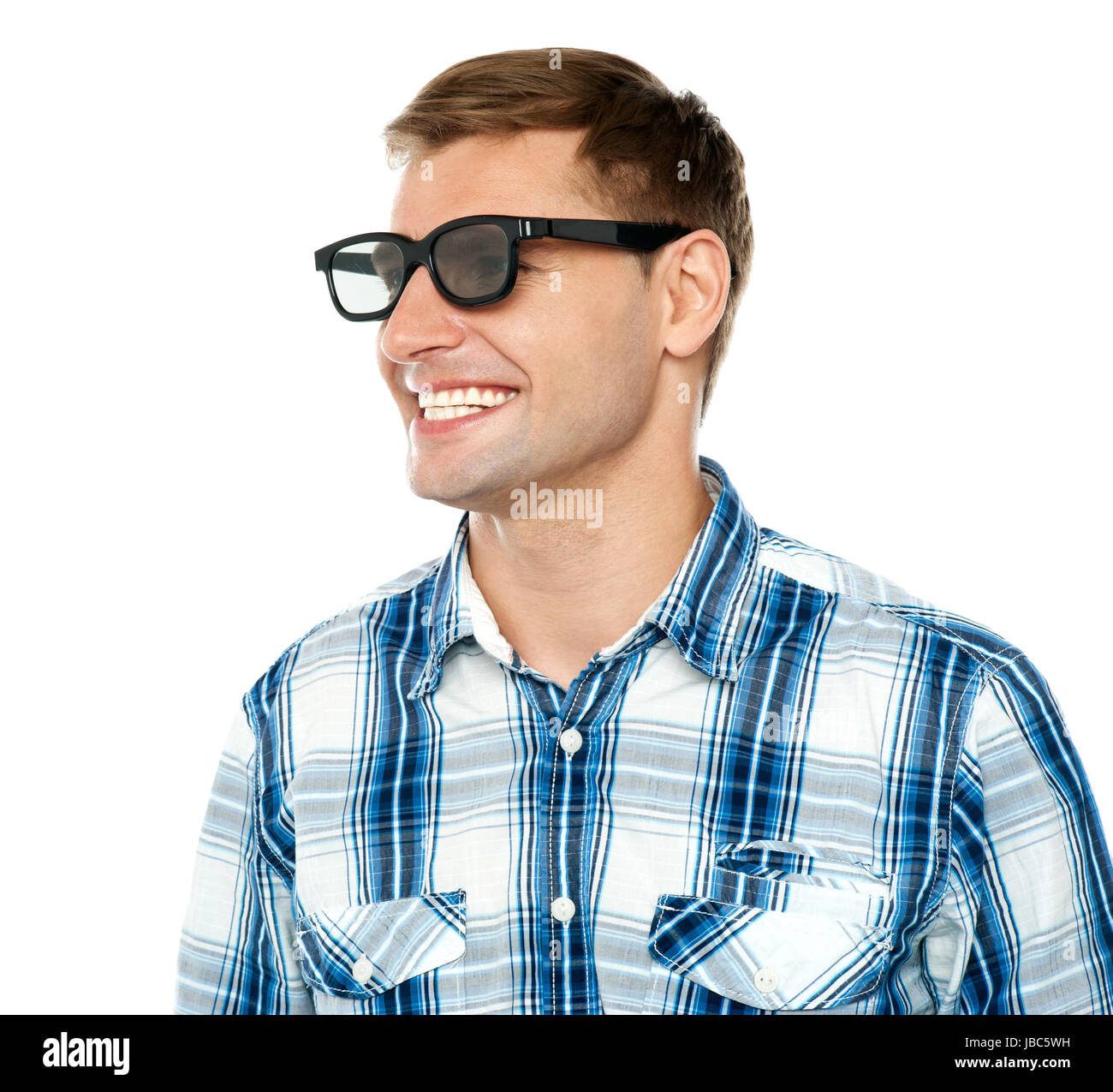 Handsome smiling young man in black goggles looking away Stock Photo ...
