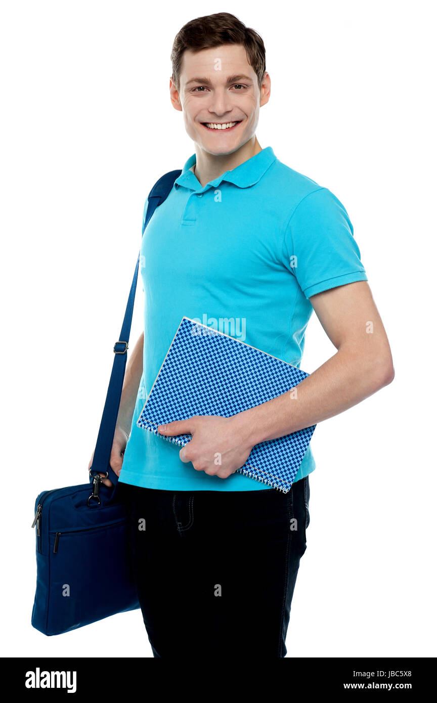 Smiling guy holding notepad and laptop bag smiling at camera Stock ...