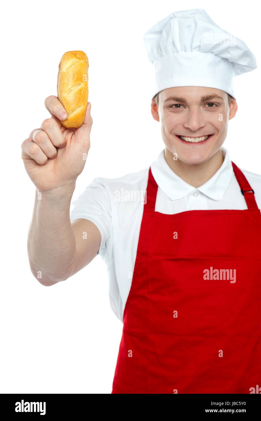 Its time for some yummy hot dog. Chef showing bread before baking it ...