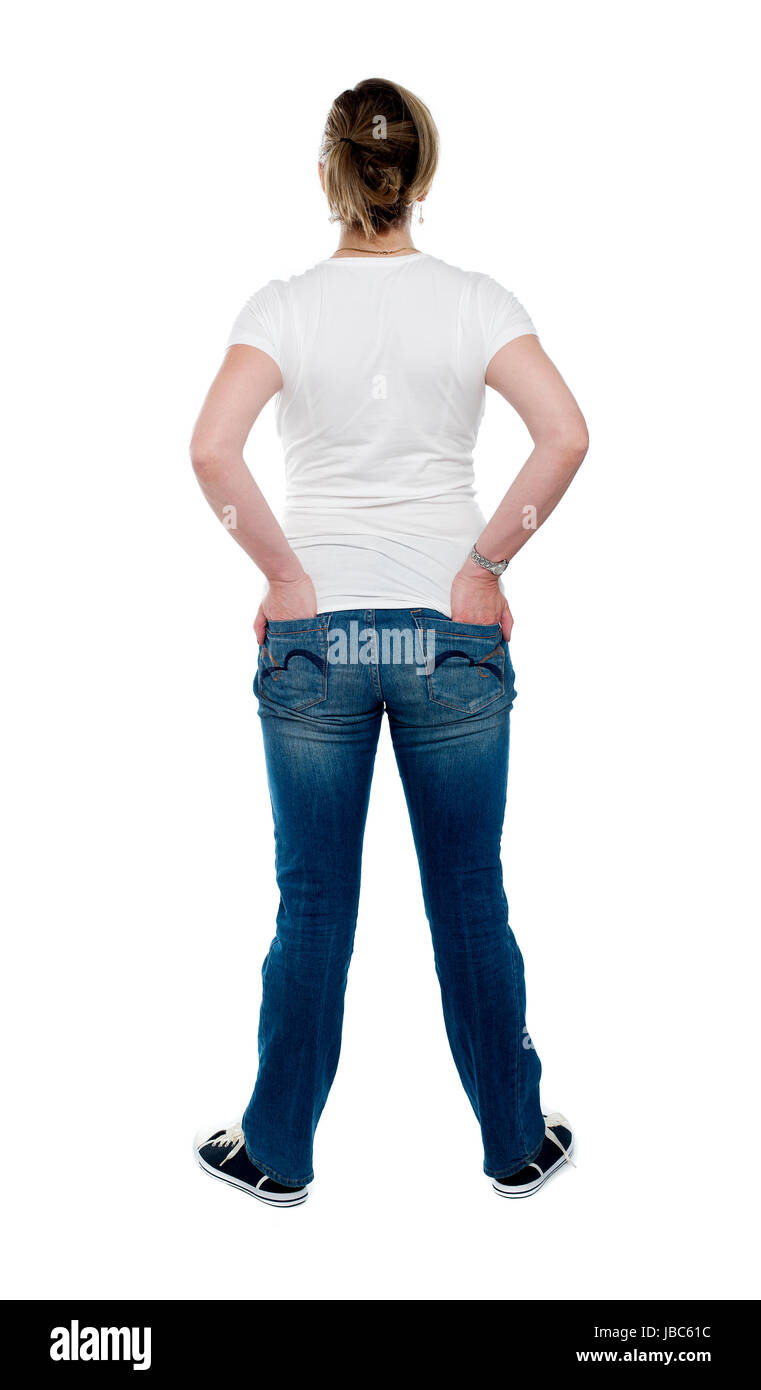 Back view of trendy woman with hands in pocket. Full length shot Stock ...