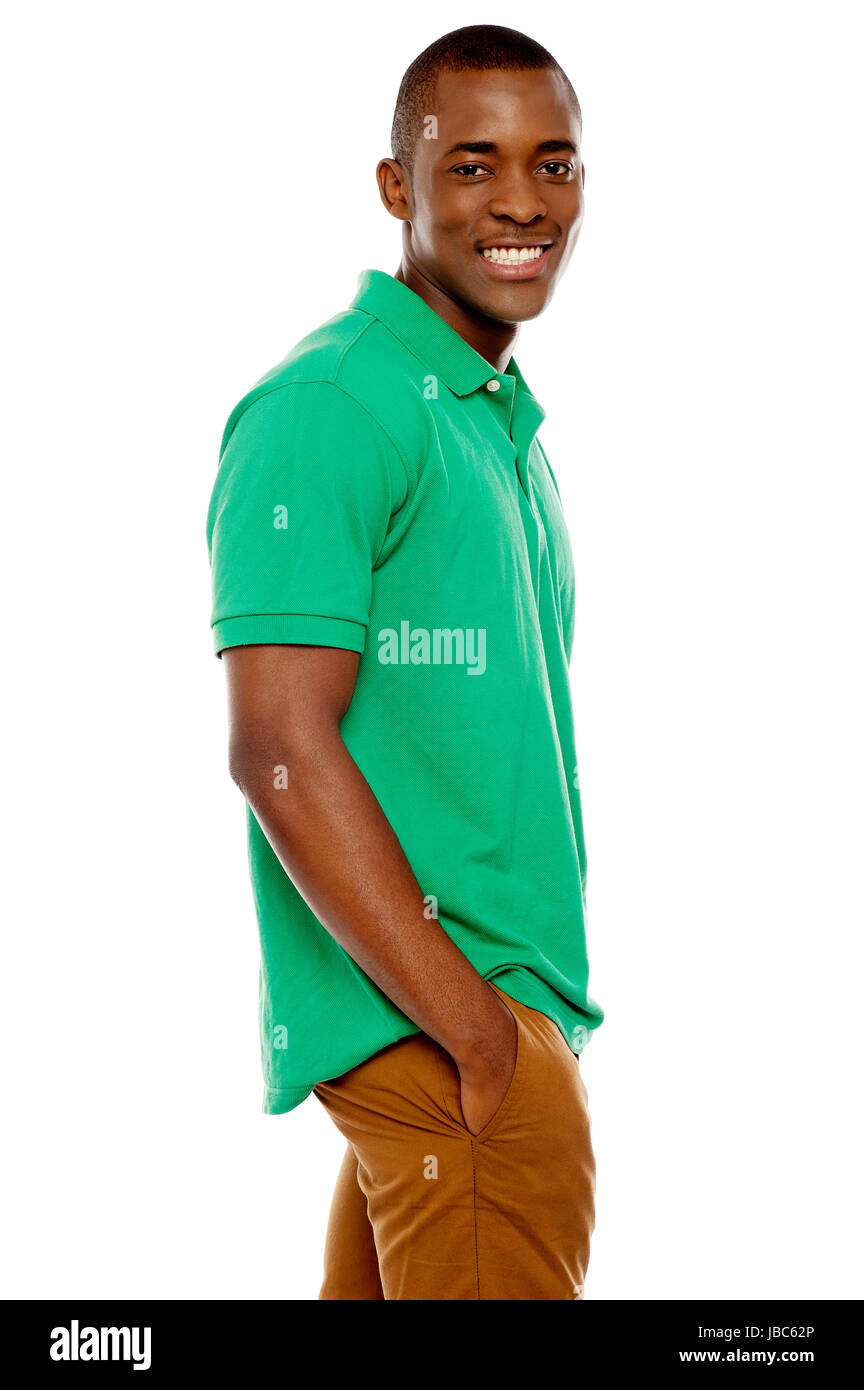 Side view portrait of smiling casual african guy posing with hands in ...