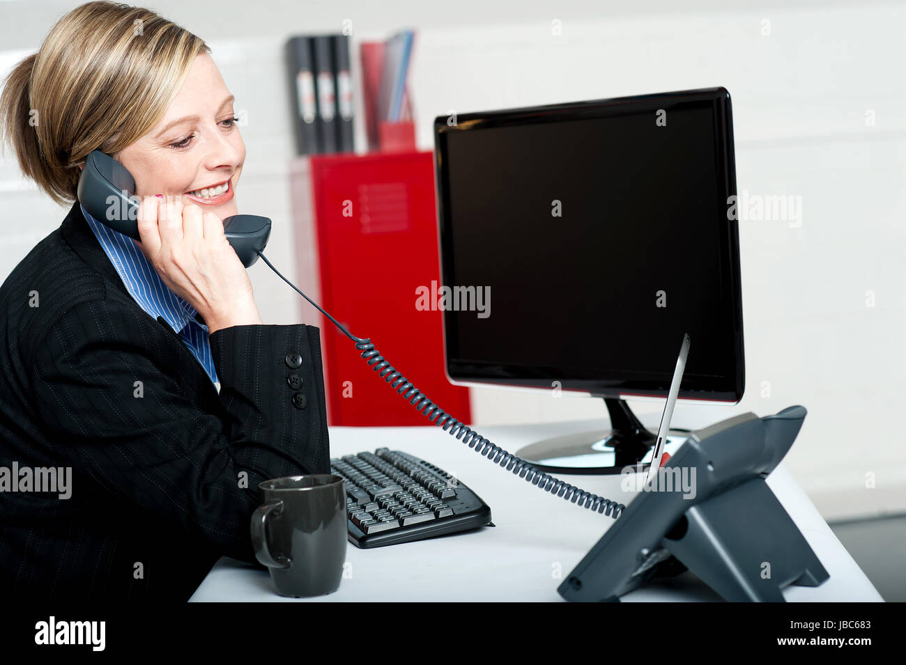 Female secretary answering bosses call and informing updates Stock ...