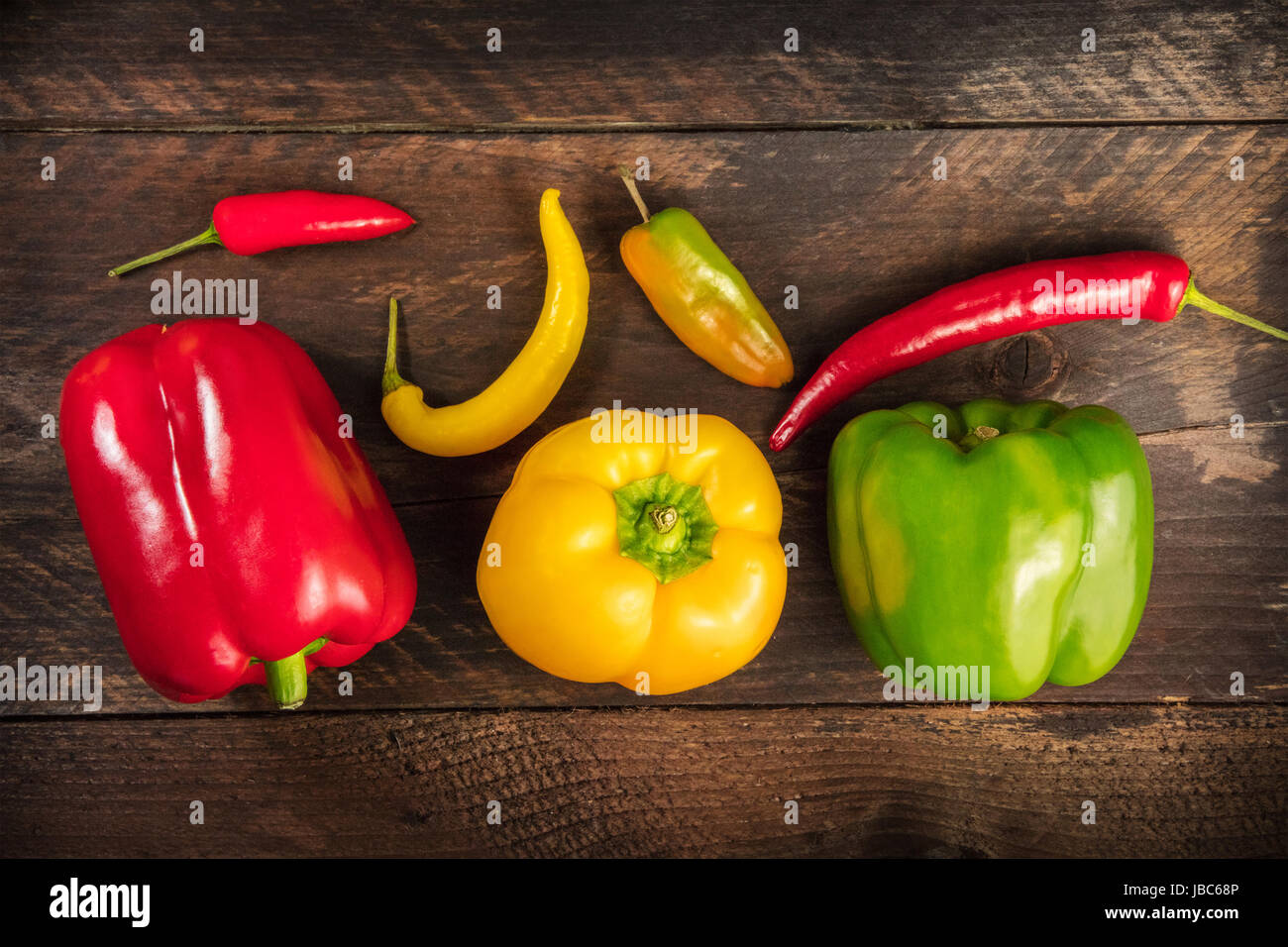An overhead photo of vibrant colourful fresh bell peppers and chillies ...