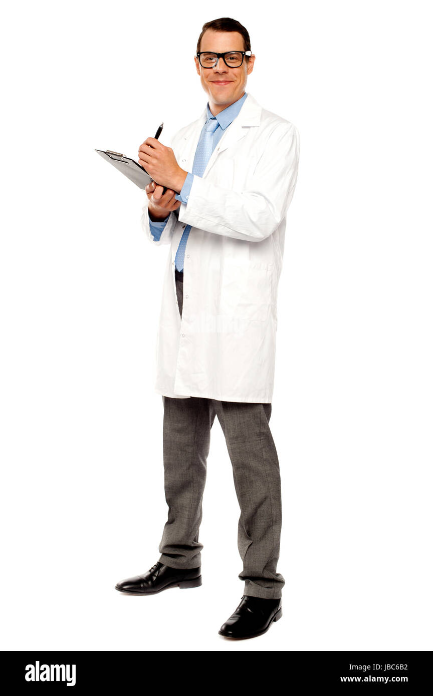 Young physician writing medical report isolated against white ...