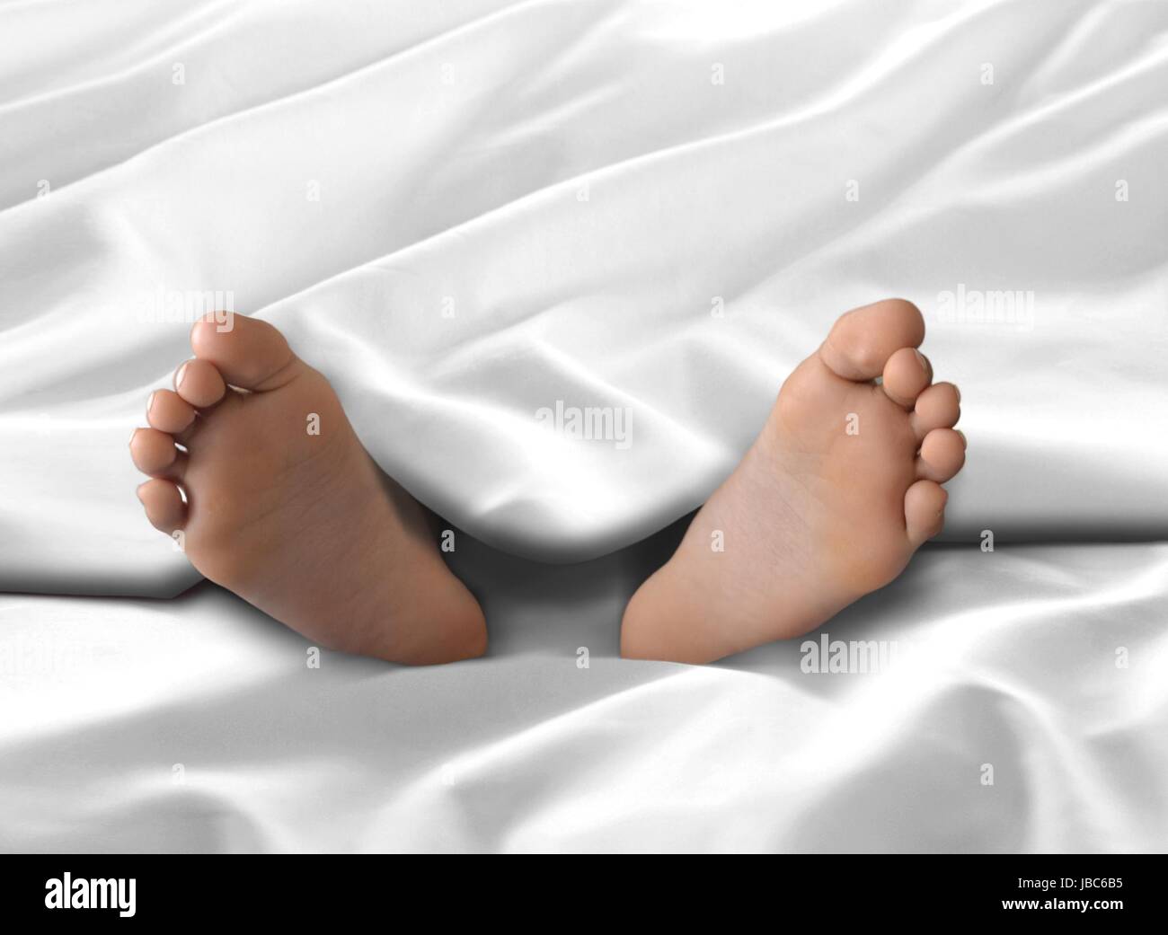 Feet under sheets hi-res stock photography and images - Alamy