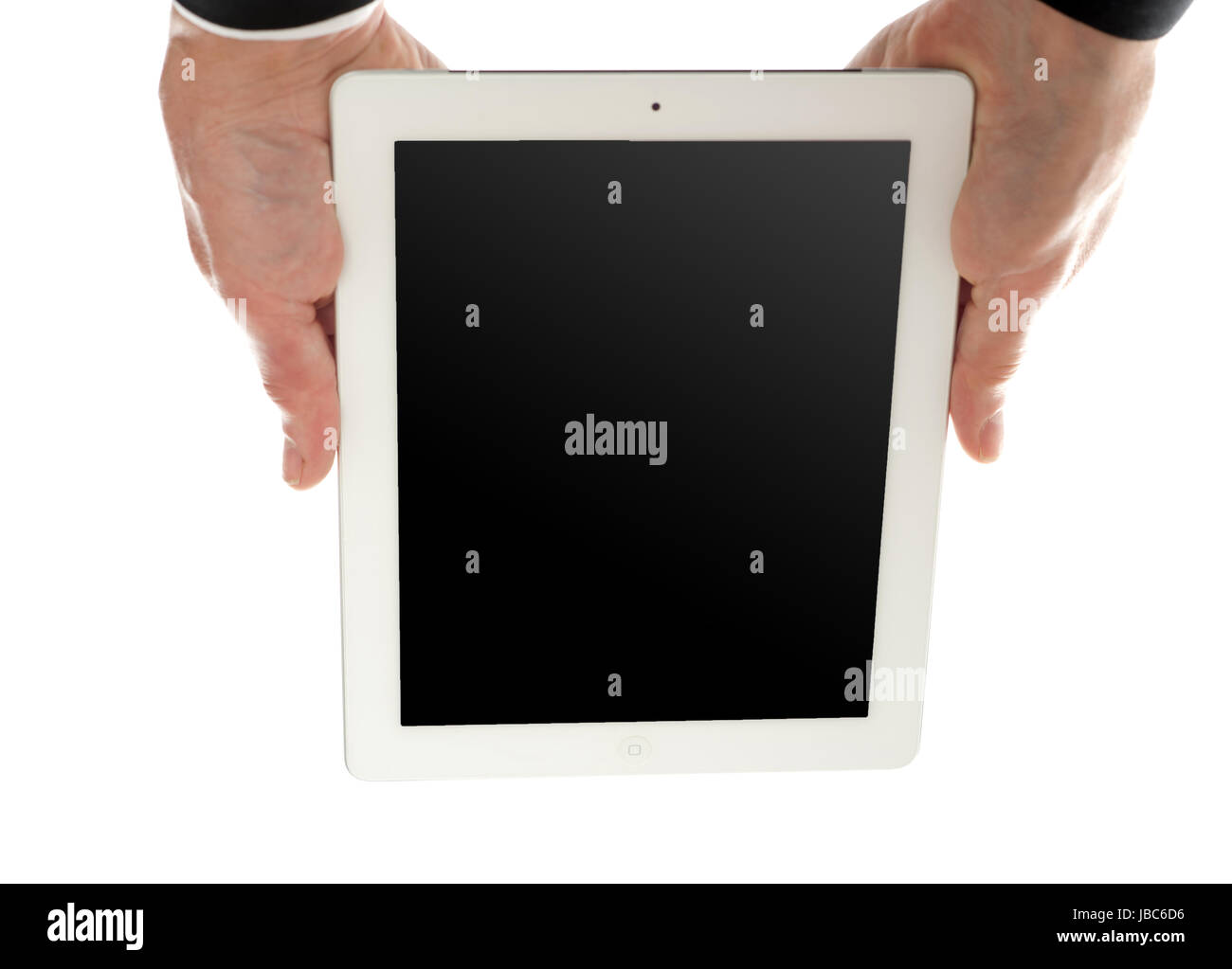 Man holding tablet device upside down isolated over white background ...