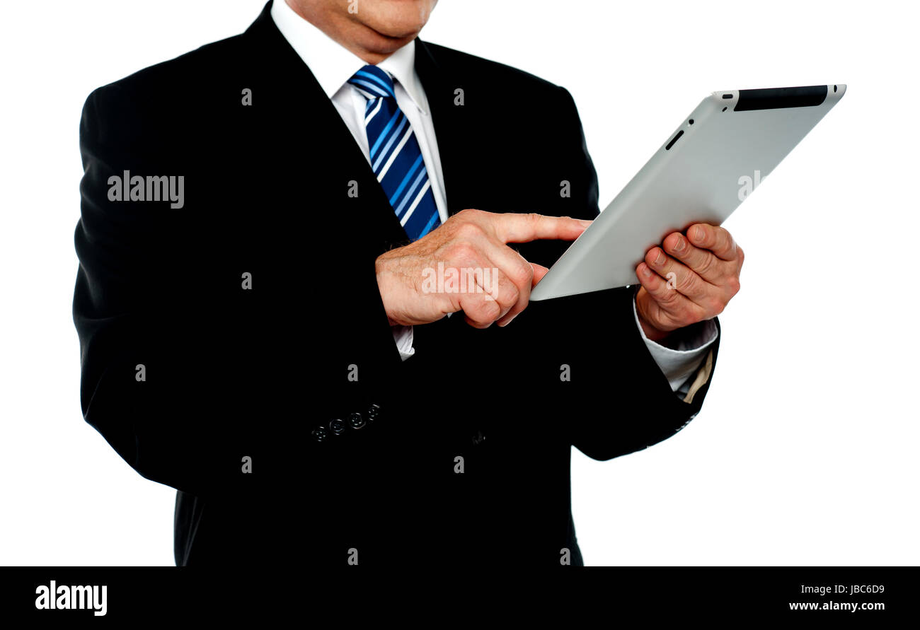 Businessman using tablet, cropped image isolated on white background ...