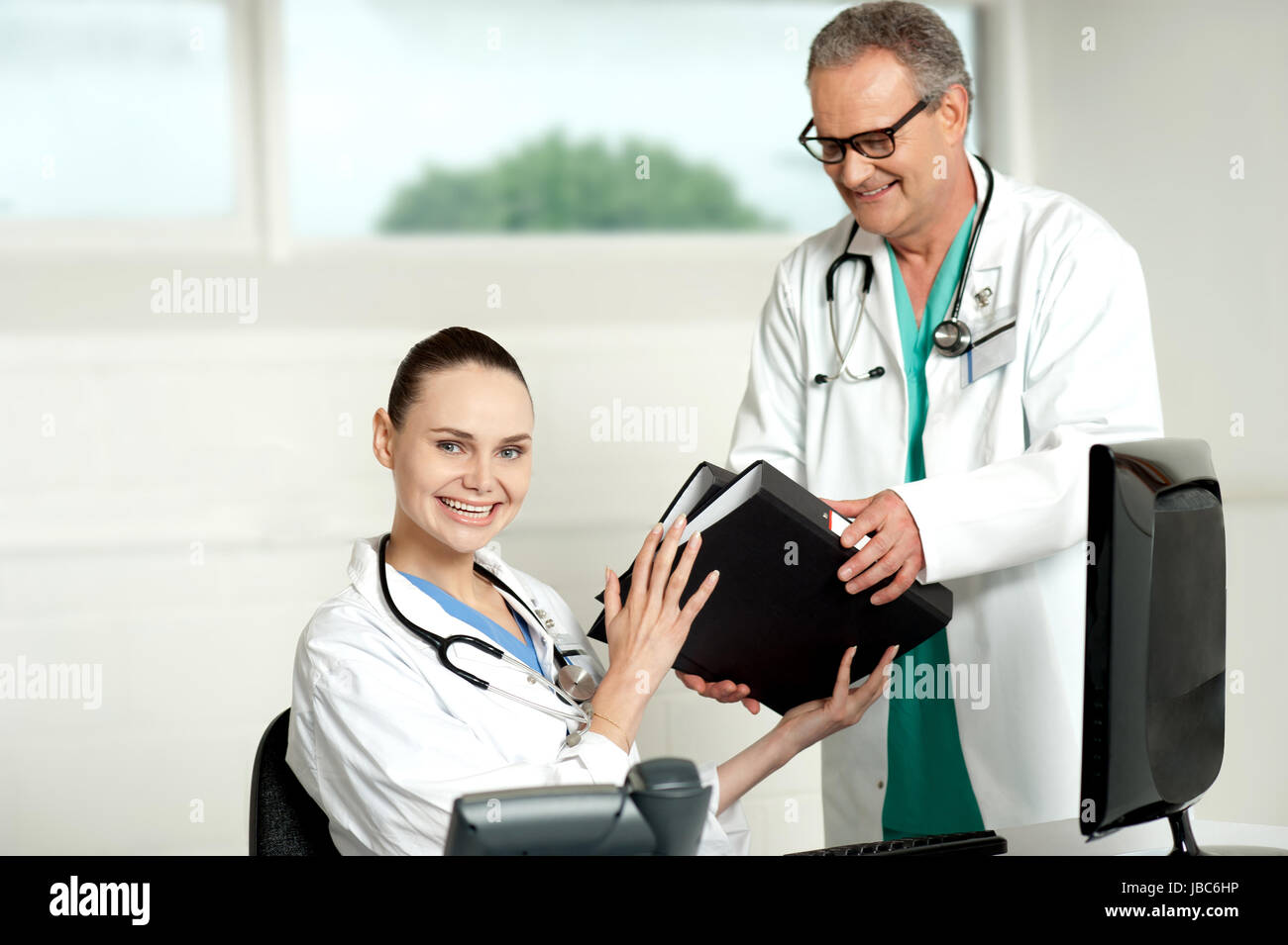 Female doctor handing over prescription hi-res stock photography and ...