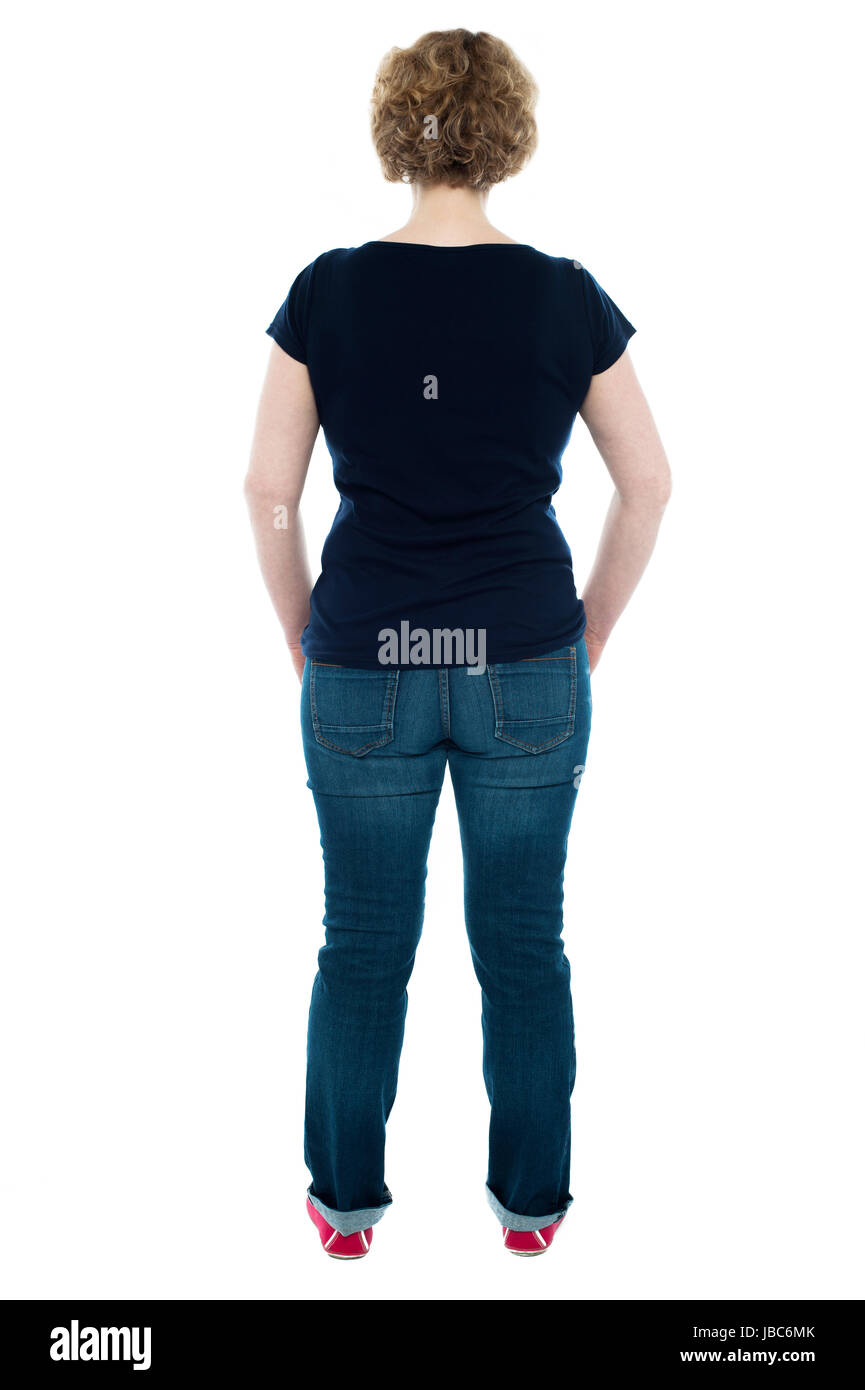 Rear view of woman posing in style, full length shot Stock Photo - Alamy
