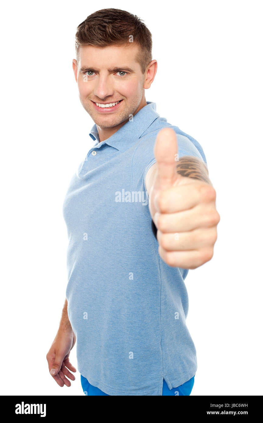 Handsome caucasian male showing thumbs up to you Stock Photo - Alamy