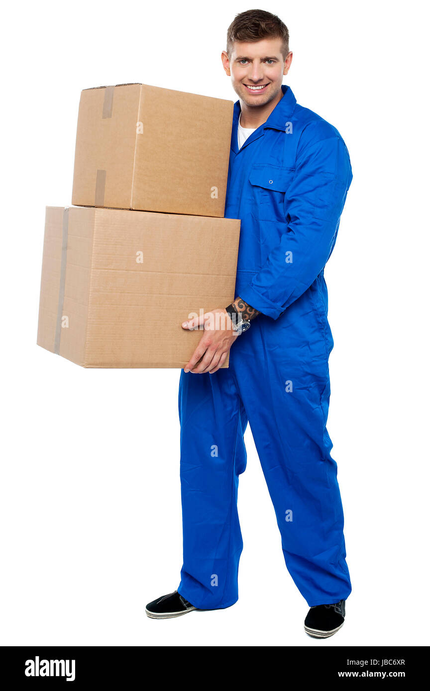 Full length portrait of young smart relocation staff carrying cartons ...