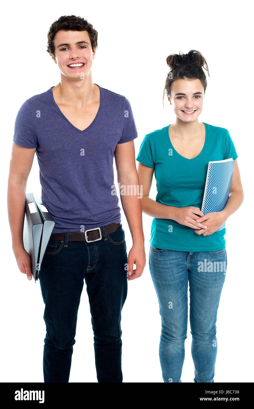 Fashionable college going students posing over white background Stock ...